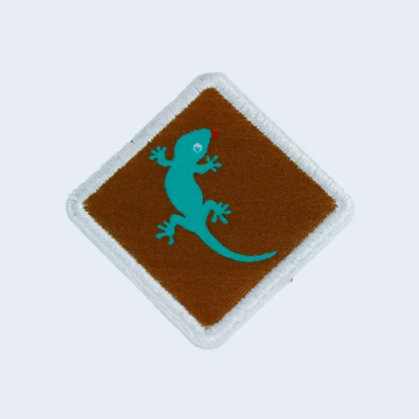 Distintivo de Progressão Filhotes - Tixa (Calango) | Loja Escoteira